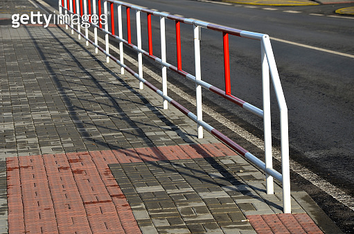 metal safety road railing at school. protects children from running ...