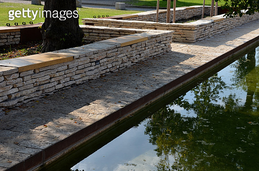 stone marl walls with stone cladding by the pool, ponds, fire tanks ...