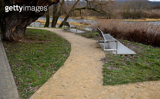 newly created natural embankment by river. benches, terraces, relaxed ...