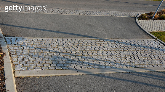 safety ramp for slowing down traffic to a residential street where ...