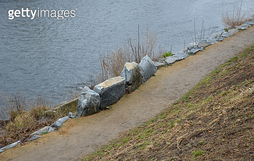 newly created natural embankment by river. benches, terraces, relaxed ...