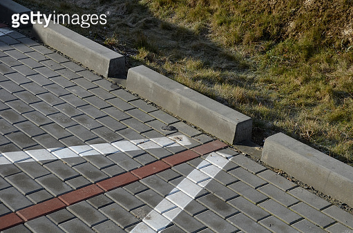 installation of concrete curbs with gaps that let water into the park ...