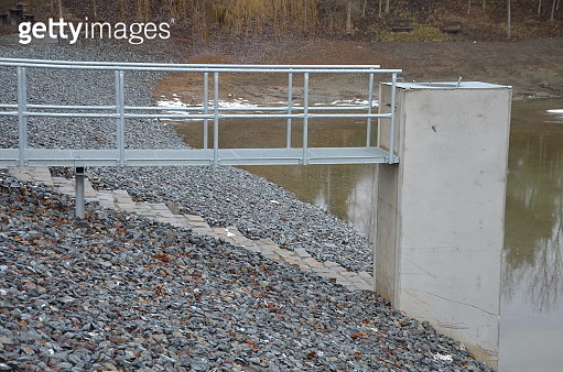 pond sluice, water reservoirs with regulation and concrete dam shaft ...