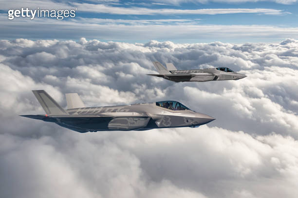 Two fighter jets flying over clouds 이미지 (1316200910) - 게티이미지뱅크