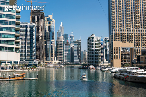 Channel in Dubai Marina. Modern buildings in Dubai, UAE. In the city of ...