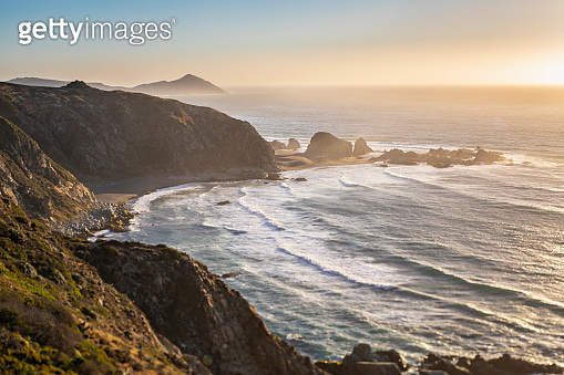 An awe sunset in an idyllic beach landscape with the sunset over the ...