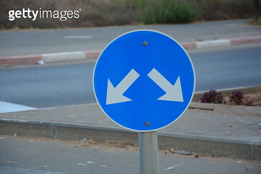 Traffic direction sign 'Pass either side'. Pass designated place on ...