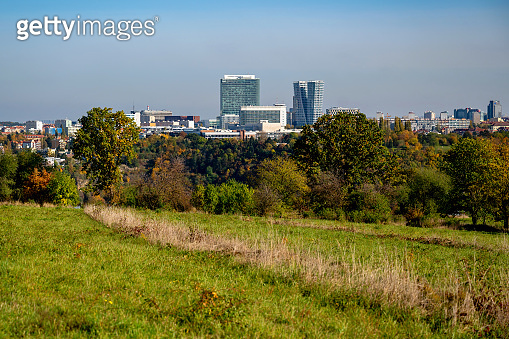 Tall buildings, tree and meadow in Divci Hrady recreation area in ...