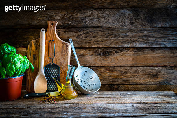 Cooking backgrounds: cutting board and kitchen utensils on wooden table ...