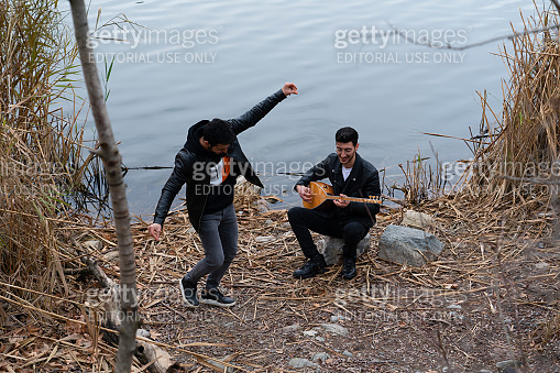 Man playing baglama, traditional turkish folk music instrument and the ...