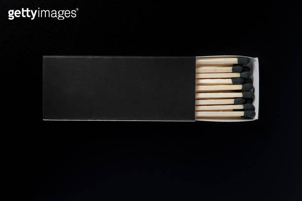 black matchbox and black match sticks on a black background 이미지 (1304164330) - 게티이미지뱅크