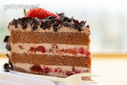 side view chocolate flavor cake with strawberry close up horizontal ...