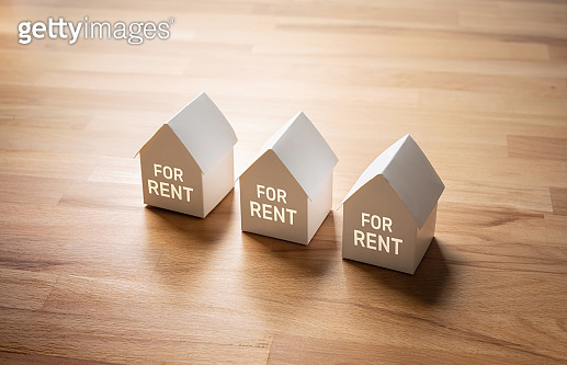 Property or real estate concepts with for rent text and house model on ...