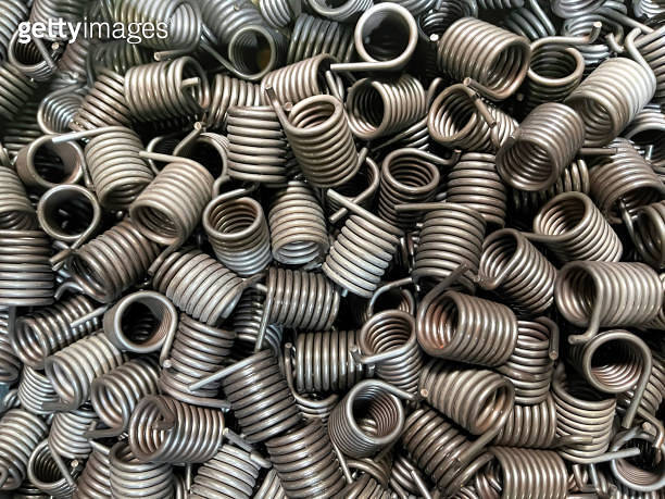 batch of torsion springs viewed from above, spring texture, mass ...