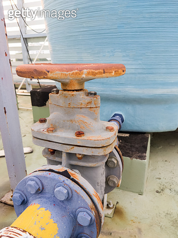 The Large water valve with the handle wheel for controlling the water ...