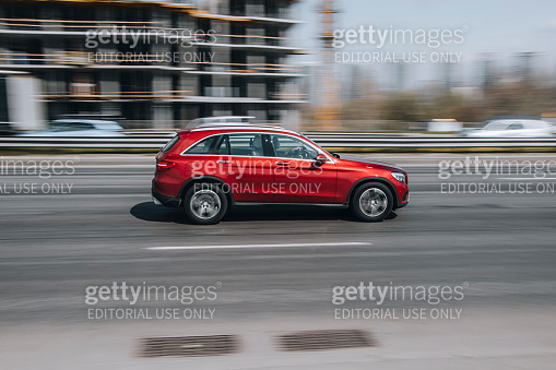 Red Mercedes-Benz GLC car moving on the street. 이미지 (1324964680) - 게티이미지뱅크