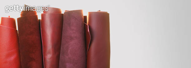 Leather red and burgundy rolls.Leatherworking banner.Leather industry ...