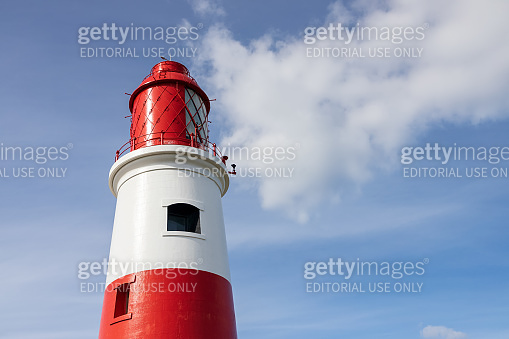 A red and white lighthouse (Souter Lighthouse) on a lovely summer day ...