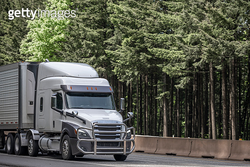 Low profile roof big rig semi truck with grille guard transporting ...