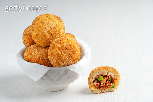 Arancini Italian deep fried rice balls with mince and green peas served ...