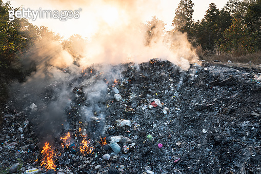 Garbage and fire burn in landfill cause of air pollution, environmental ...