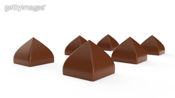 pyramid shaped chocolate candy on White background. Exclusive molded ...