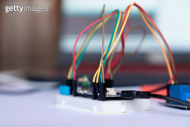 Electronic devices, LEDs, resistors, and microcontrollers on an ...