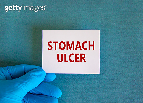 Medical and stomach ulcer symbol. Doctor hand. White card with words ...