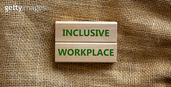 Inclusive workplace symbol. Wooden blocks with words Inclusive ...