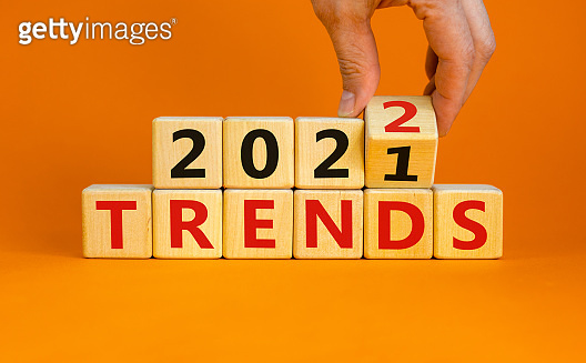Trends 2022 new year symbol. Businessman turns wooden cubes, changes ...