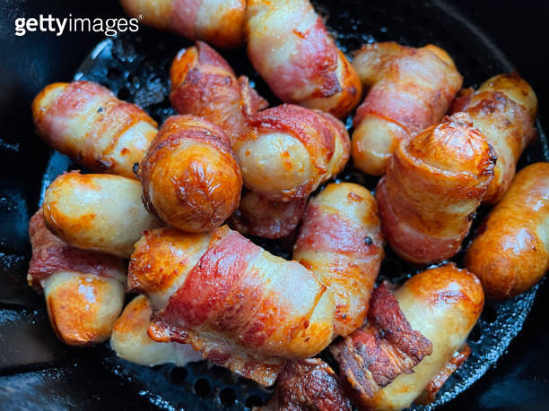 Full frame image of pigs in blankets (pork cocktail sausages wrapped in ...