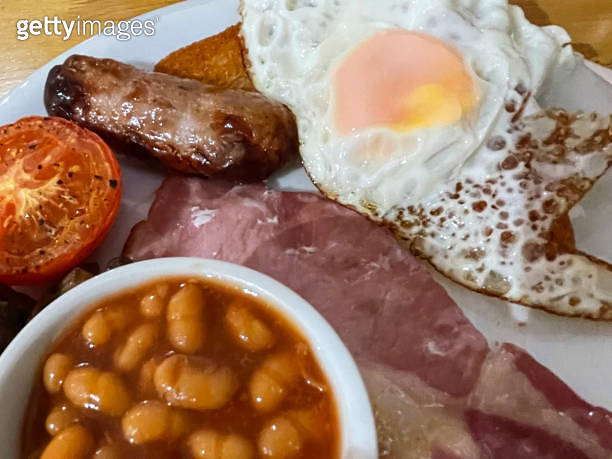 Full frame image of full English fried breakfast of bacon rasher ...