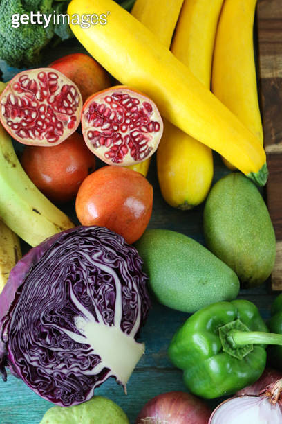 Close-up image of rainbow display of multi-coloured fruit and ...