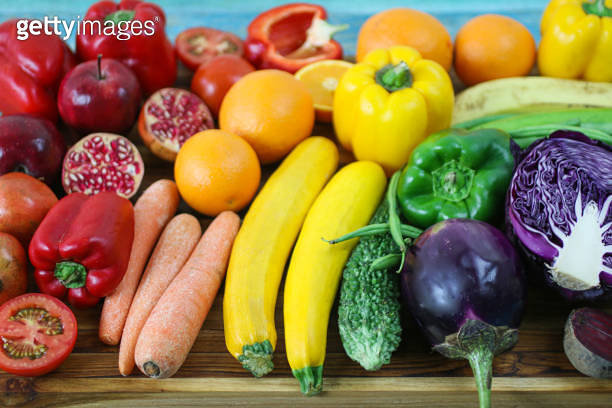 Close-up image of rainbow display of multi-coloured fruit and ...