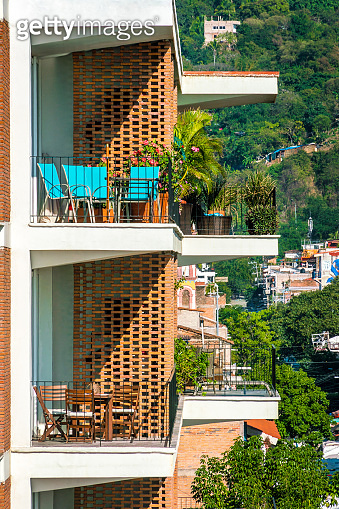 Modern designed residential building with balconies looking out to the ...