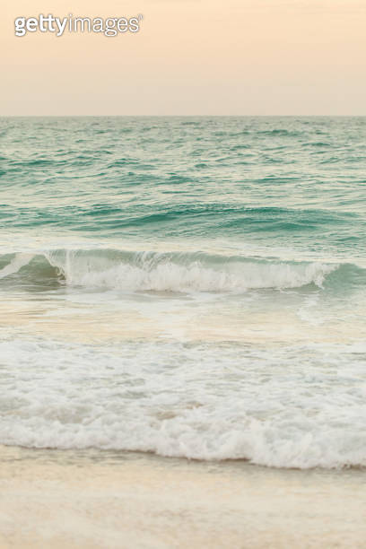 Pastel Sunset Over Teal Ocean Waves on the Shoreline of Palm Beach ...