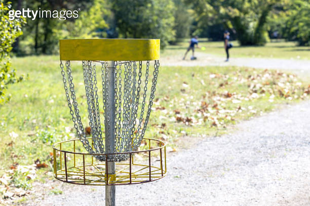 People playing flying disc golf sport game in the park 이미지 (1360527571 ...