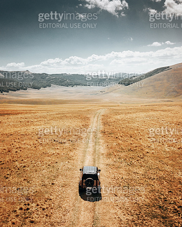 Aerial view of the New Land Rover Defender in the dry italian ...