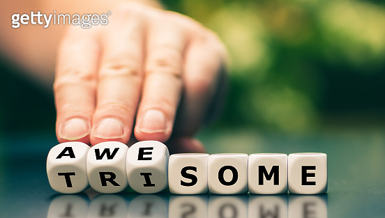 Symbol for a awesome life with trisomy. Dice forms the words awesome ...