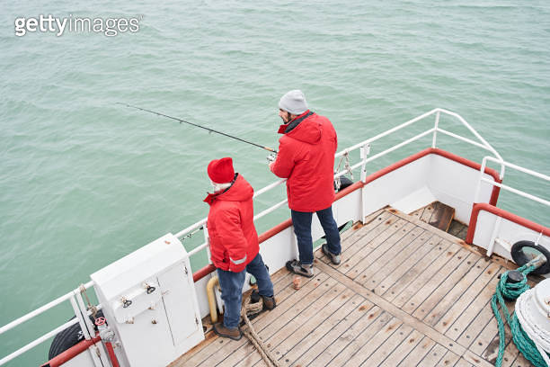 Two fishermans holding fishing rod to fighting fish 이미지 (1298331620 ...