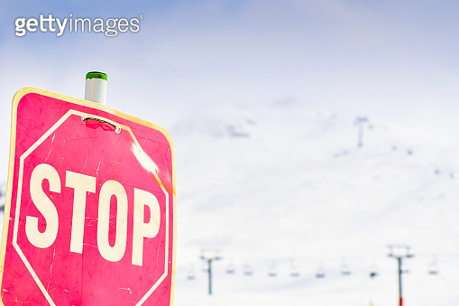 Red Stop post sign i ski resort with mountains panorama. Ski holiday ...