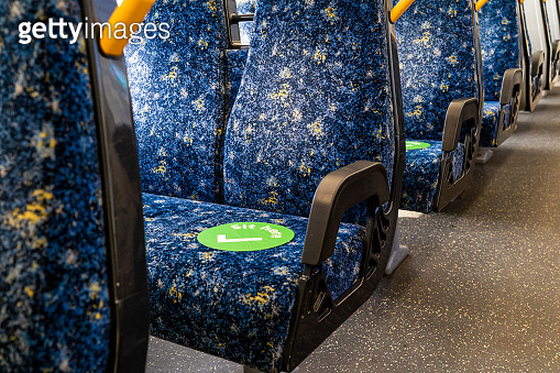 Sydney train carriage with stickers sit hear on seats for social ...