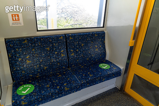 Sydney train carriage with stickers sit hear and stand here for social ...