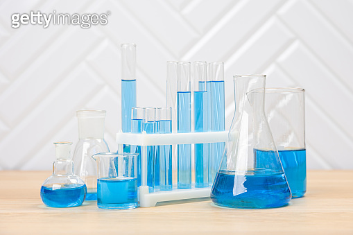 Laboratory glassware with test tubes. flasks, dropper, petri dishes ...