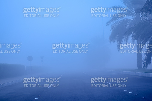 Road in the fog, sign mention keep distance for motorists at dubai road ...