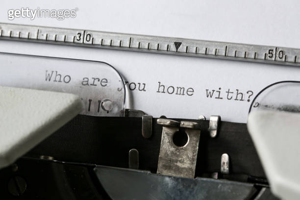 Who are you home with text on blank paper typed on a vintage typewriter ...
