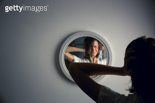 Reflection of a woman's face in broken mirror. Depression, anxiety ...
