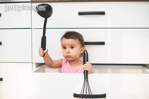 child in a drawer with the polish in his hand having fun (1323925846 ...