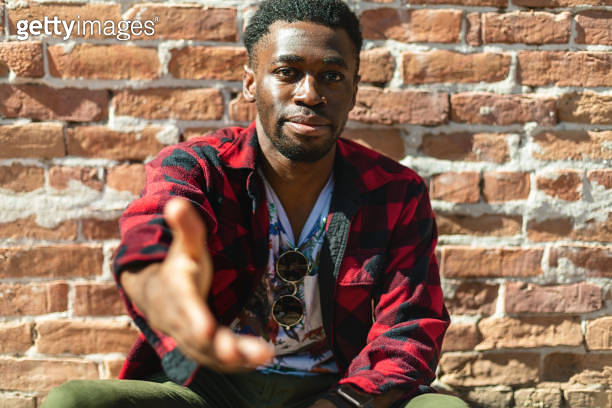 Generation Z Male of African Ethnicity Reaching for Hand Shake Photo ...