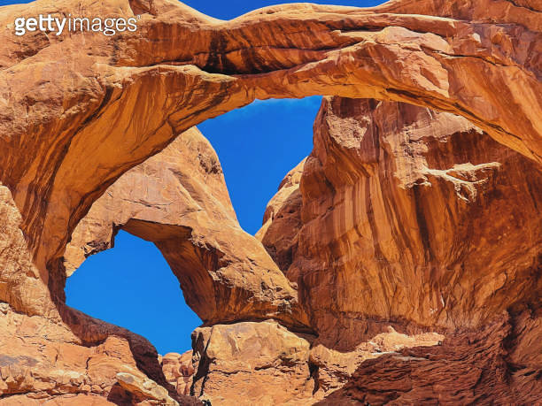 Arches National Park Double Arch Upward Angle View (1320391353) - 게티이미지뱅크